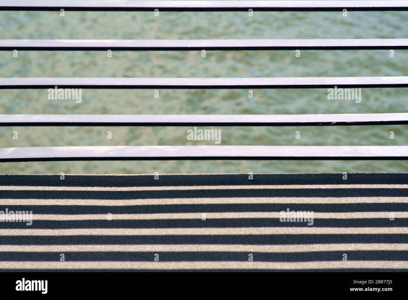 The close-up of the cross struts of a bridge railing casting ...