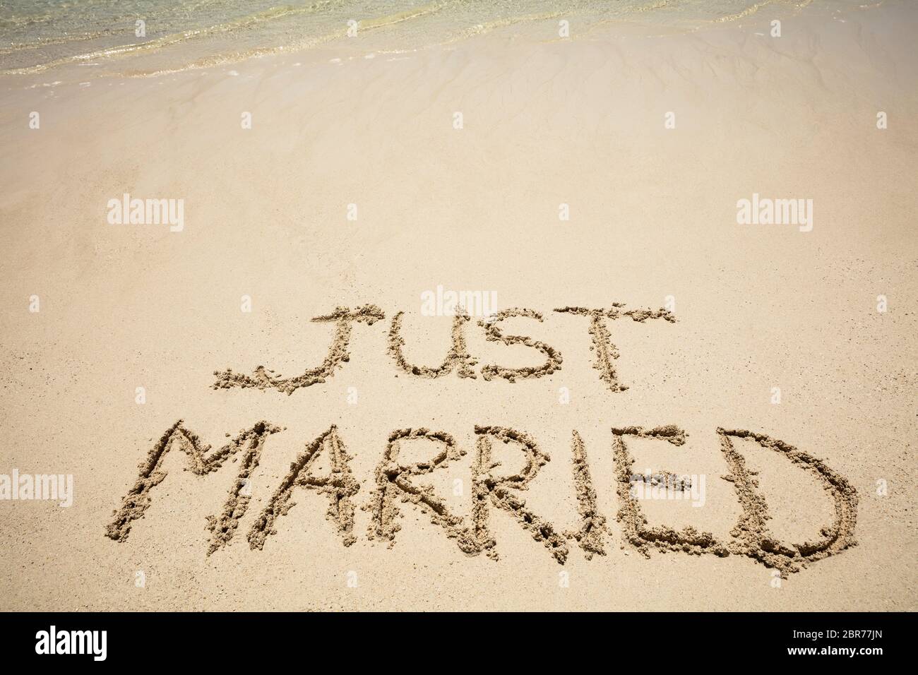 Just Married Written Text On Sand Near The Idyllic Sea At Beach Stock ...