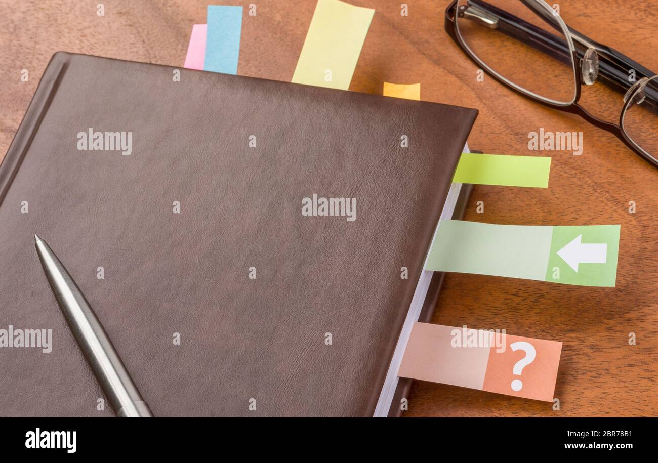 Daily planner with sticky notes Stock Photo - Alamy