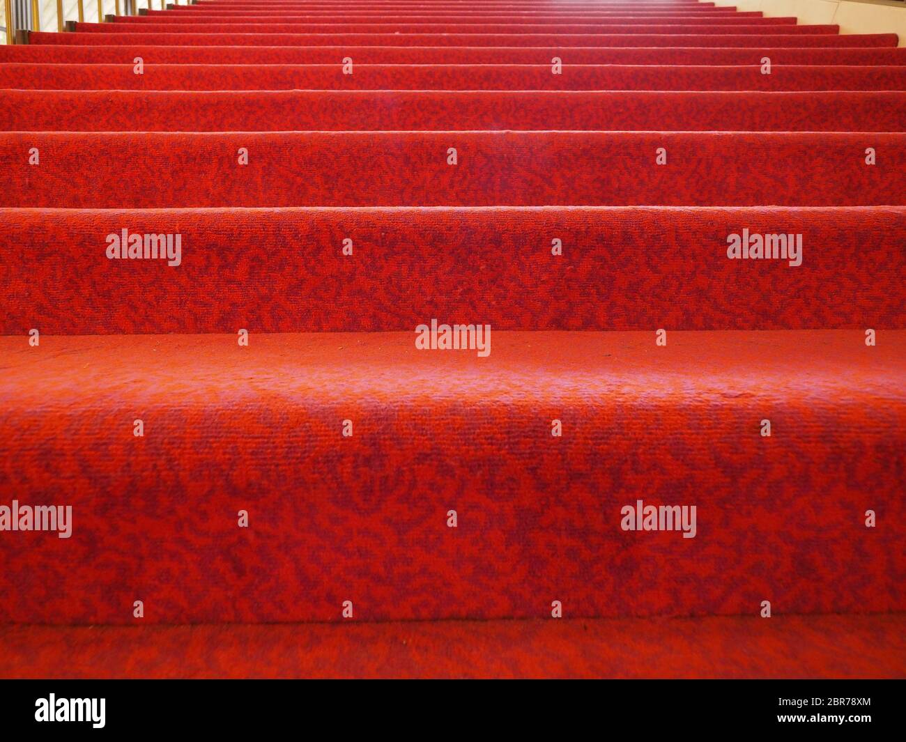 stairs with red carpet fabric useful as a background Stock Photo - Alamy