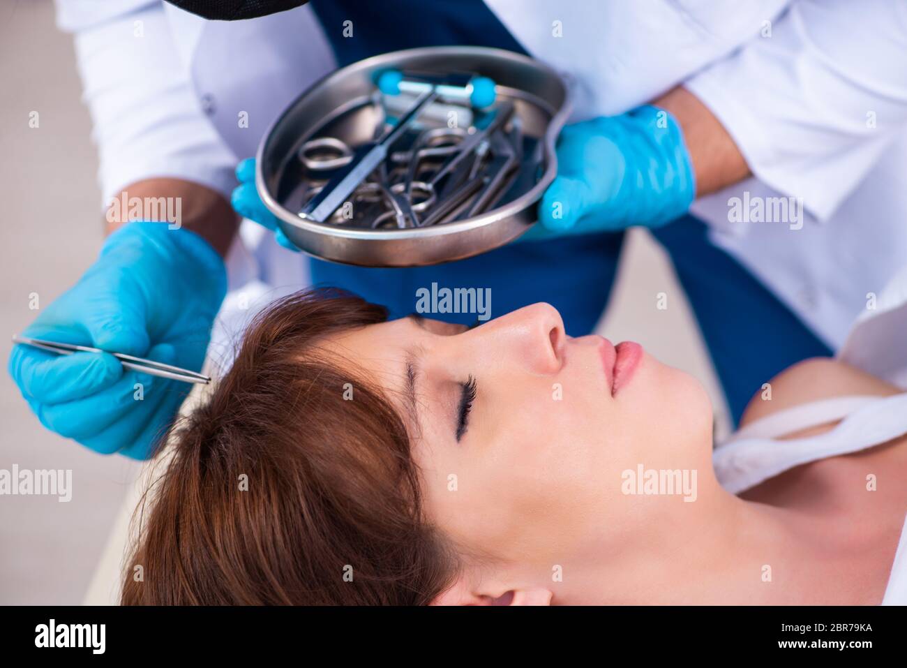 Police coroner examining dead body in morgue Stock Photo - Alamy