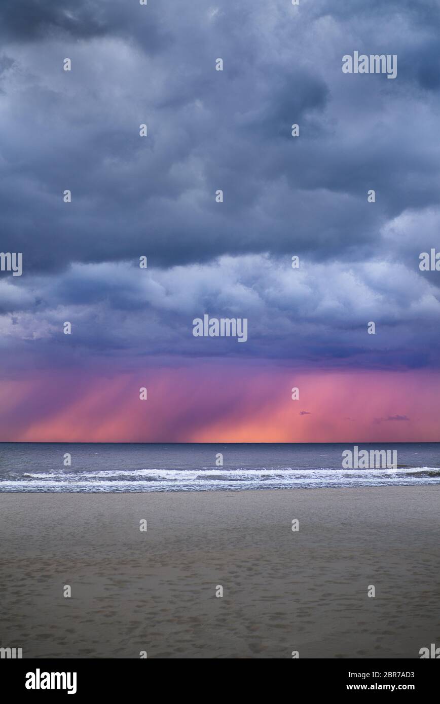 sunset beach sand colors sea sand colorful Stock Photo - Alamy