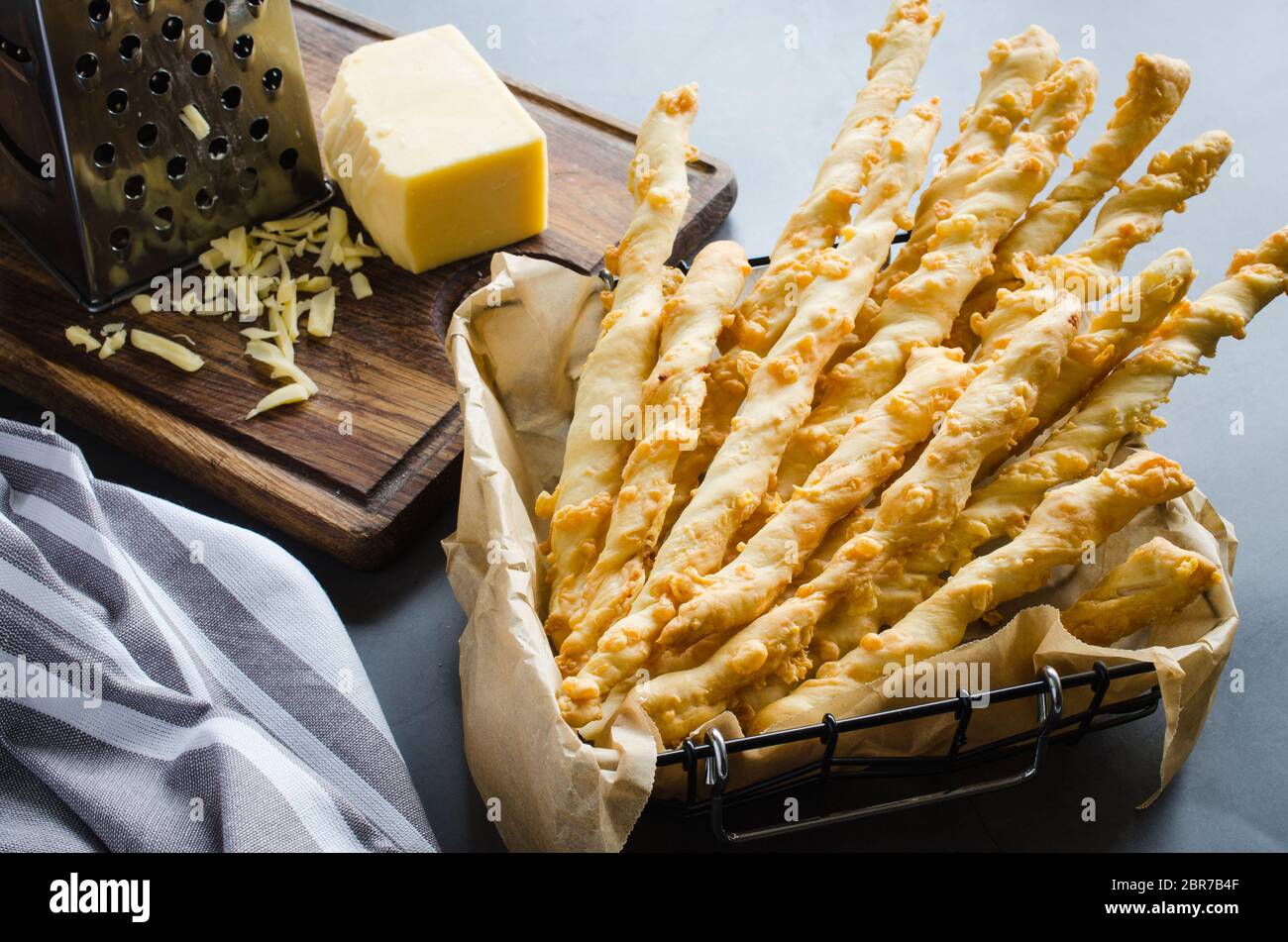 Cheese stick. Breadsticks with cheese on dark background, concept for ...