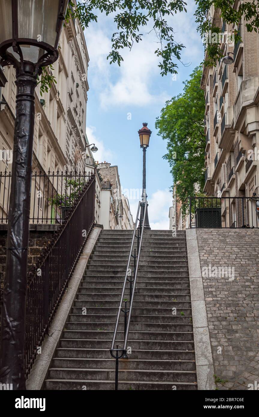 Stairs in the famous streets of Montmartre in Paris under a beautiful ...