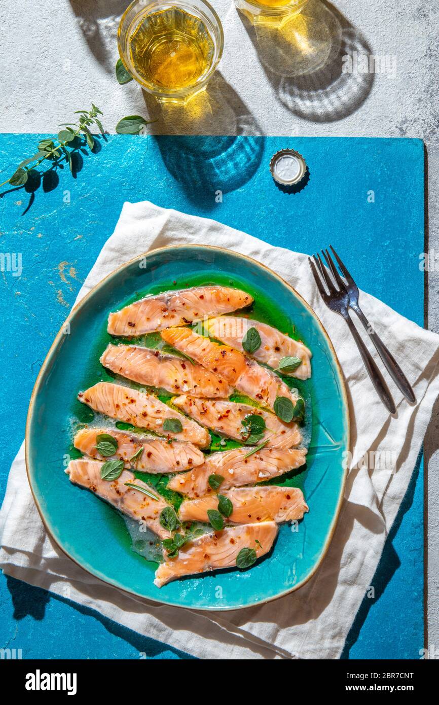 Latin American and Italian dish Crudo de Salmon. Raw Salmon marinated ...