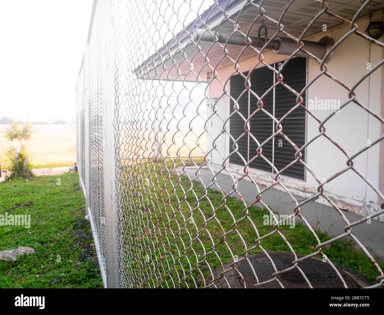 The Transformer station closed fence with barbed wire Stock Photo - Alamy