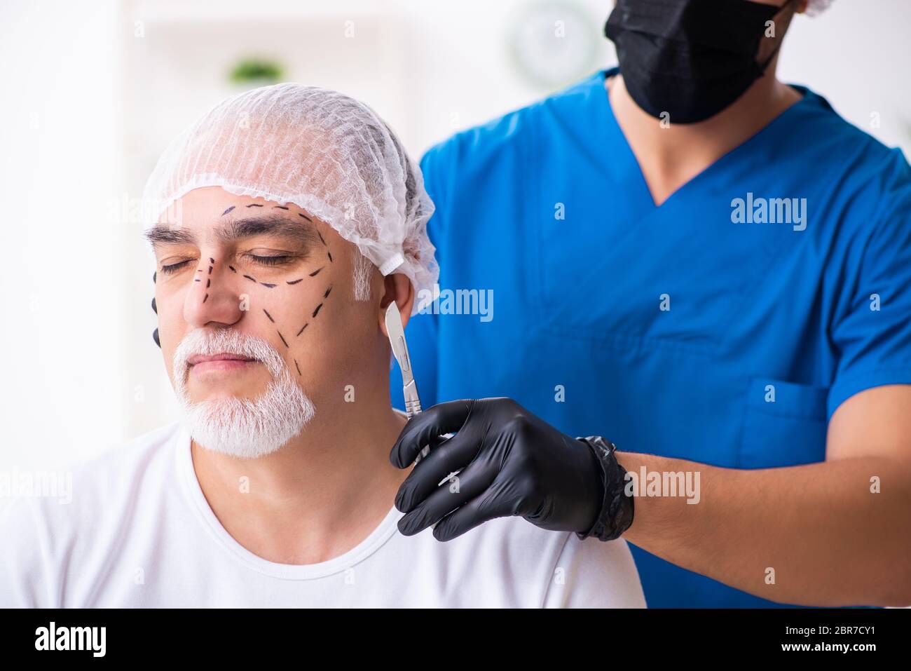Old man visiting doctor for plastic surgery Stock Photo - Alamy