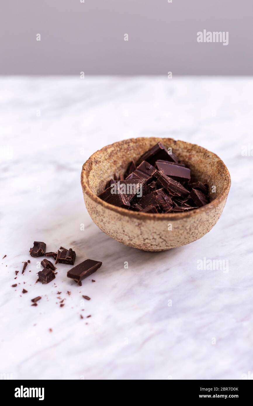 Chocolate chunks in a small ceramic bowl Stock Photo - Alamy