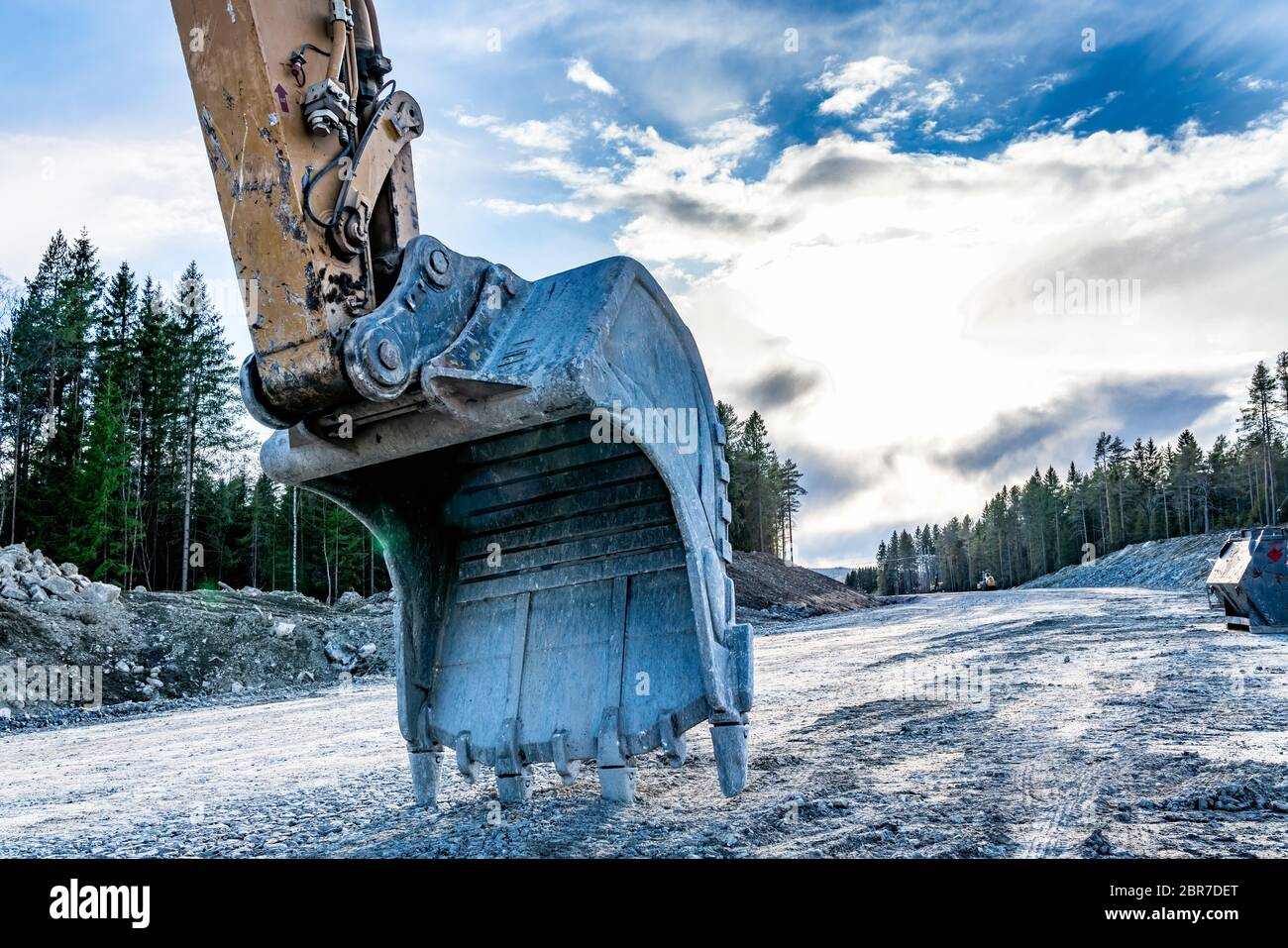 Close up back view at beautiful large excavator's scoop on new not yet ...