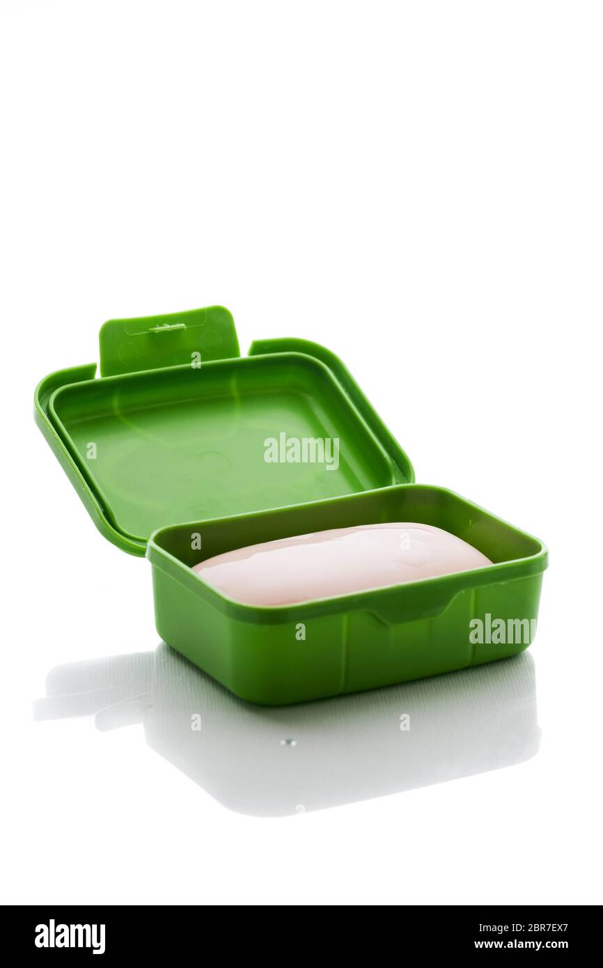 Open green soap box with inside moist soap isolated on white Stock ...