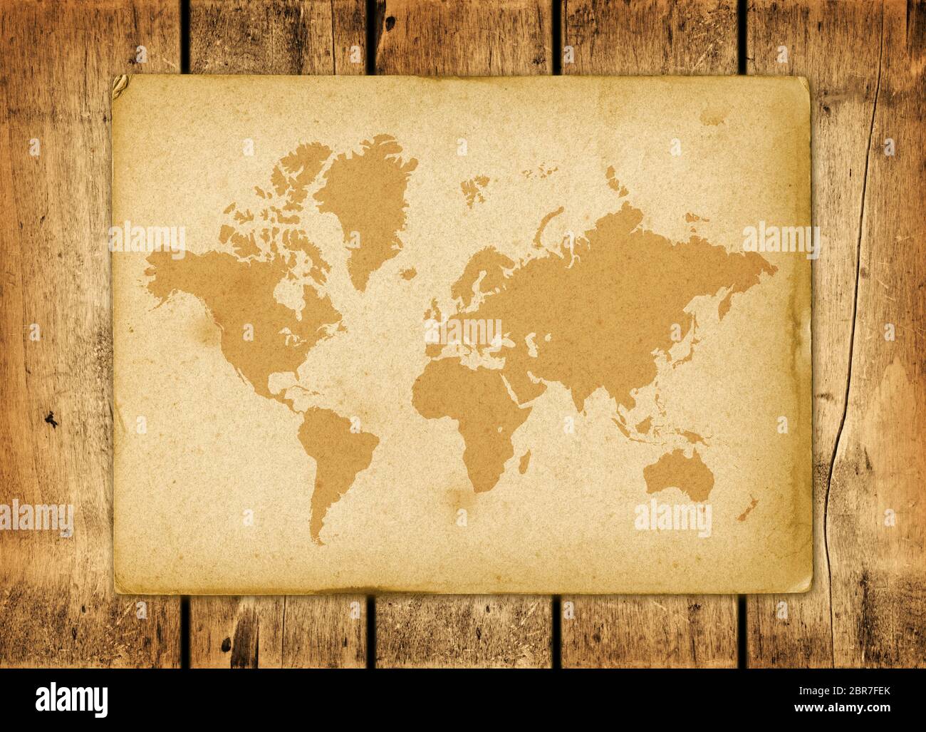 Antique vintage world map parchment on a wooden wall Stock Photo - Alamy