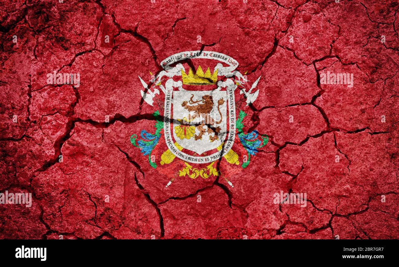 Santiago de León de Caracas flag, capital city of Venezuela, on dry ...