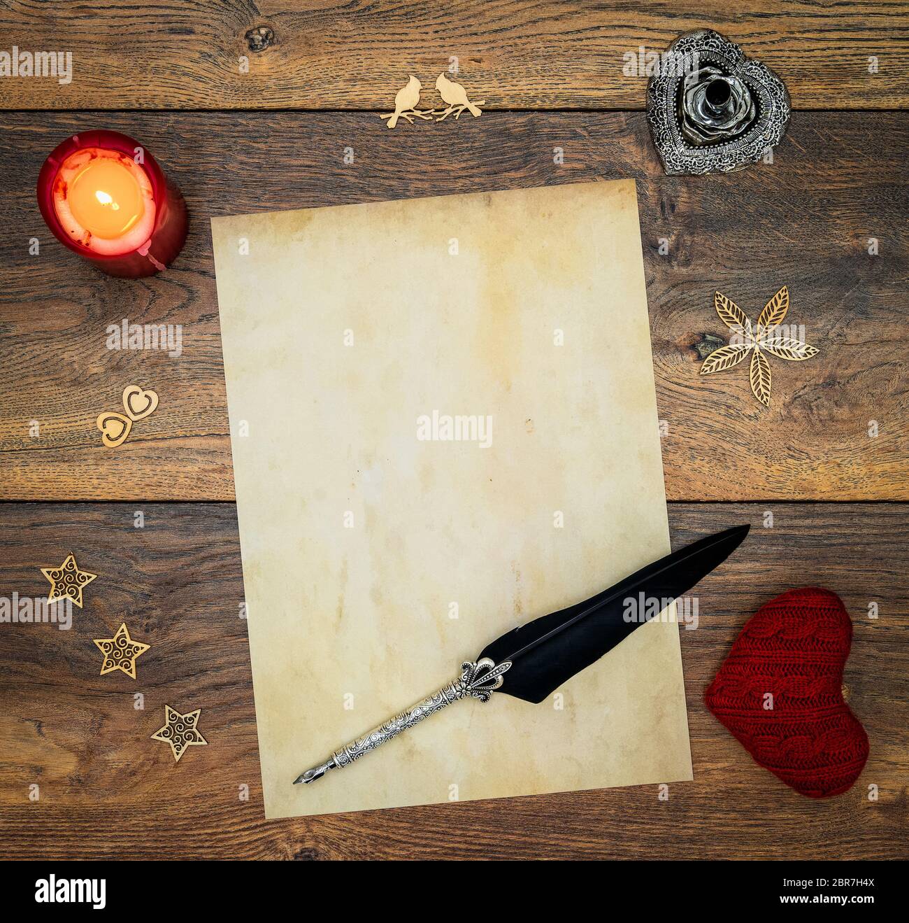 Antique blank preachment, red lit candle, red cuddle heart, wooden ...