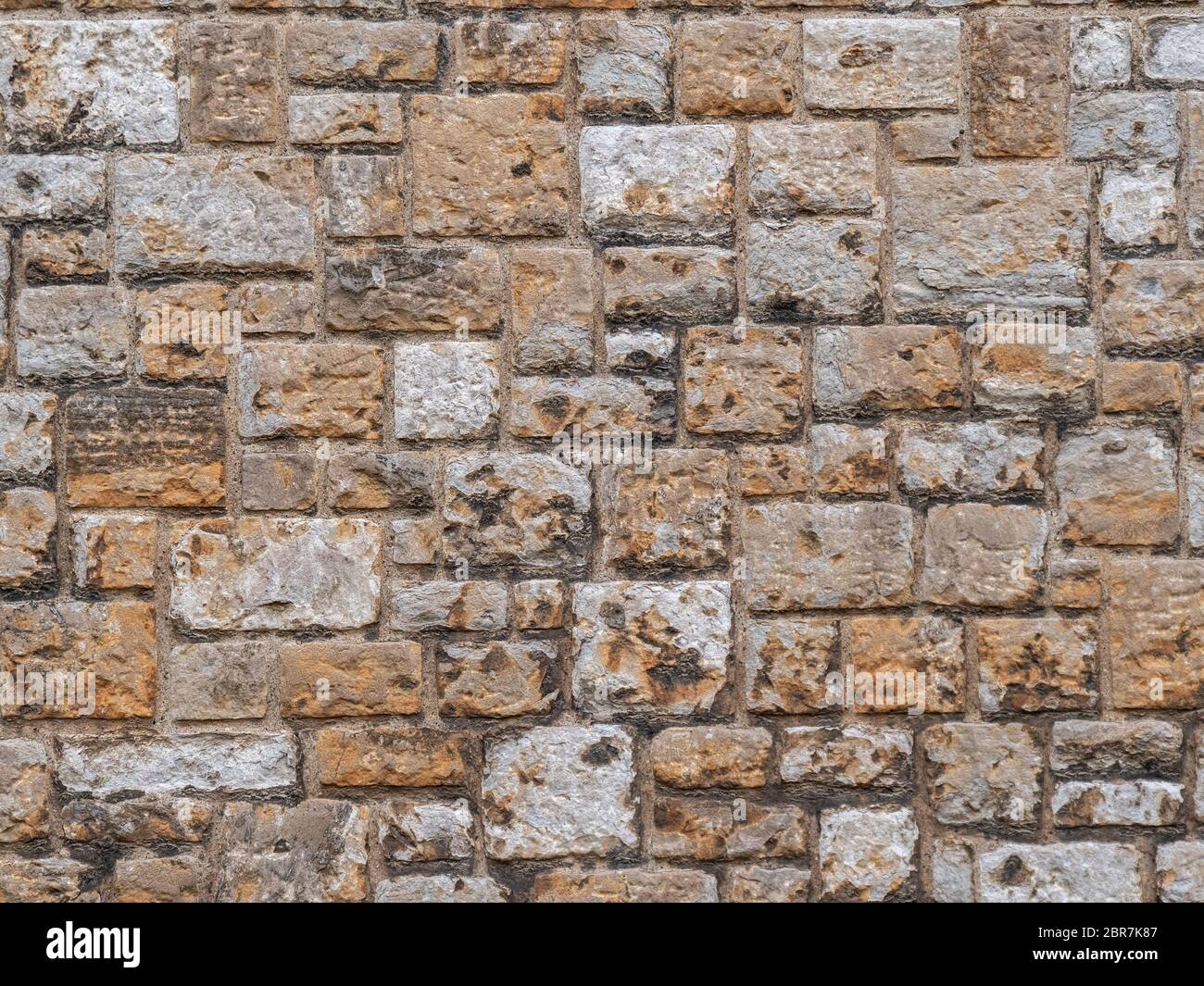 Old beige stone wall background texture close up. Texture of a stone ...