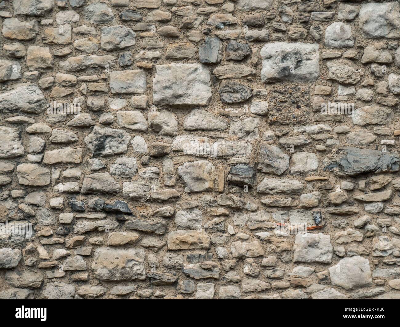Old beige stone wall background texture close up. Texture of a stone ...