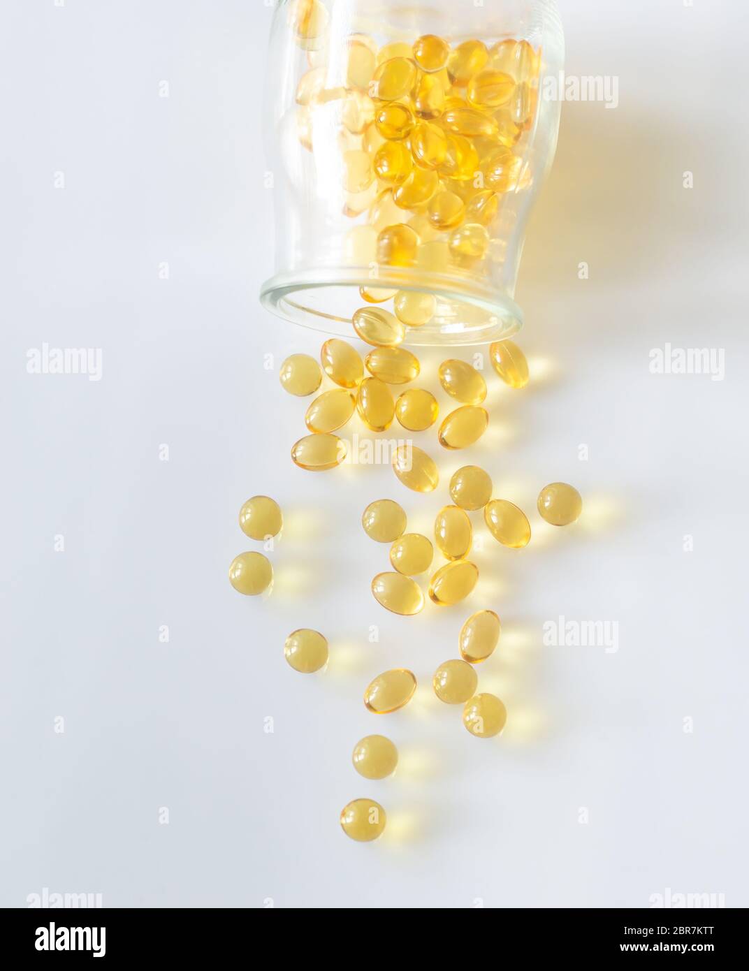 Fish fat oil capsules scattered hi-res stock photography and images - Alamy