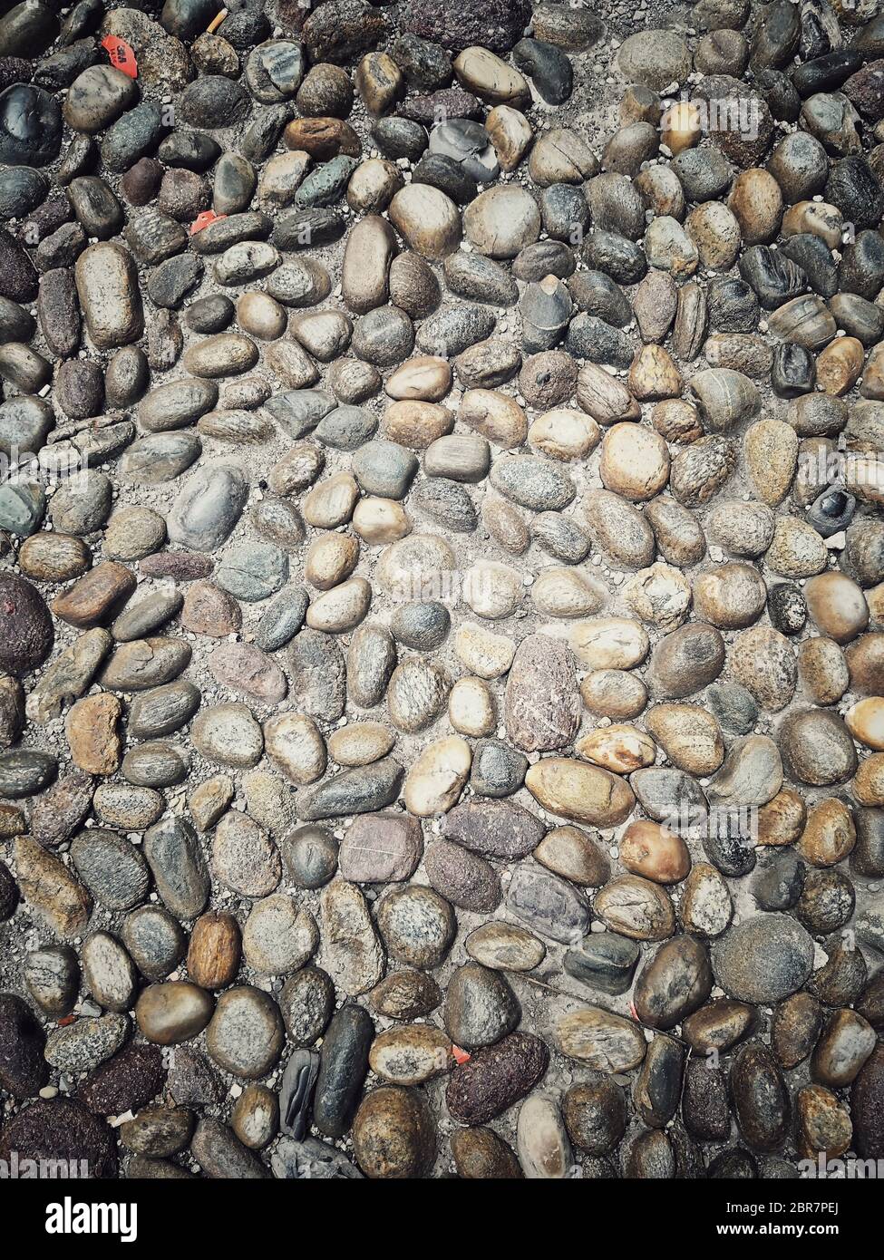 Color image of a pavement made of round stones Stock Photo - Alamy