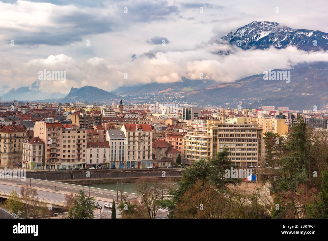 Scenic aerial view of the banks of the Isere river, bridge, roofs and ...
