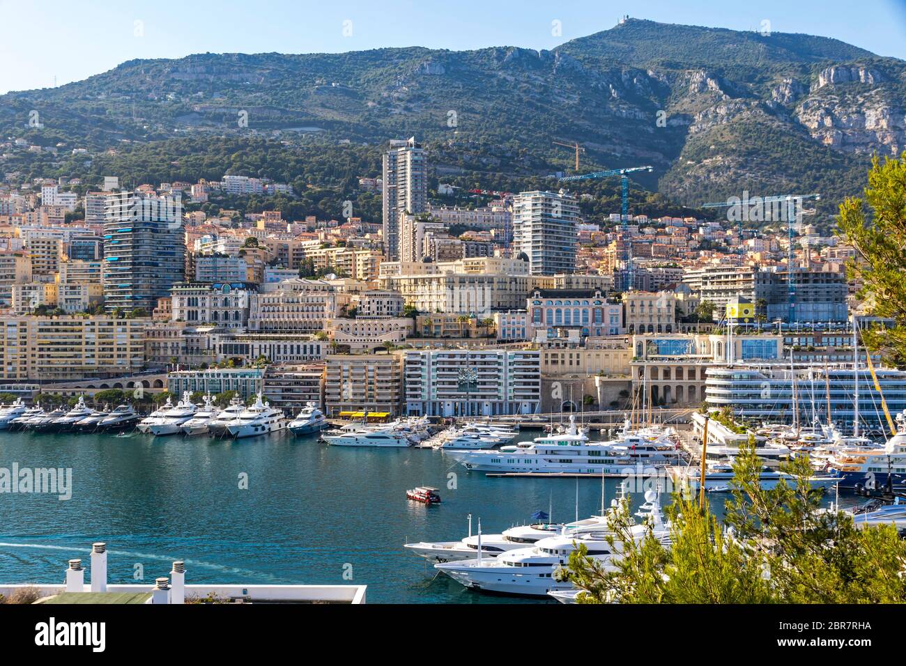 Picturesque view of luxury yachts and apartments in harbor of Monte ...
