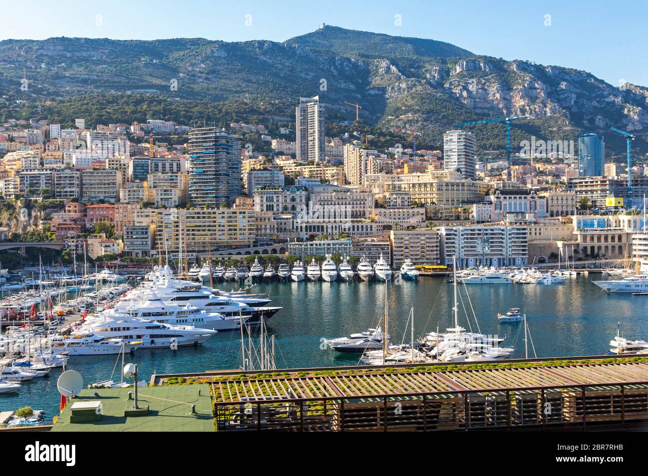 Picturesque view of luxury yachts and apartments in harbor of Monte ...