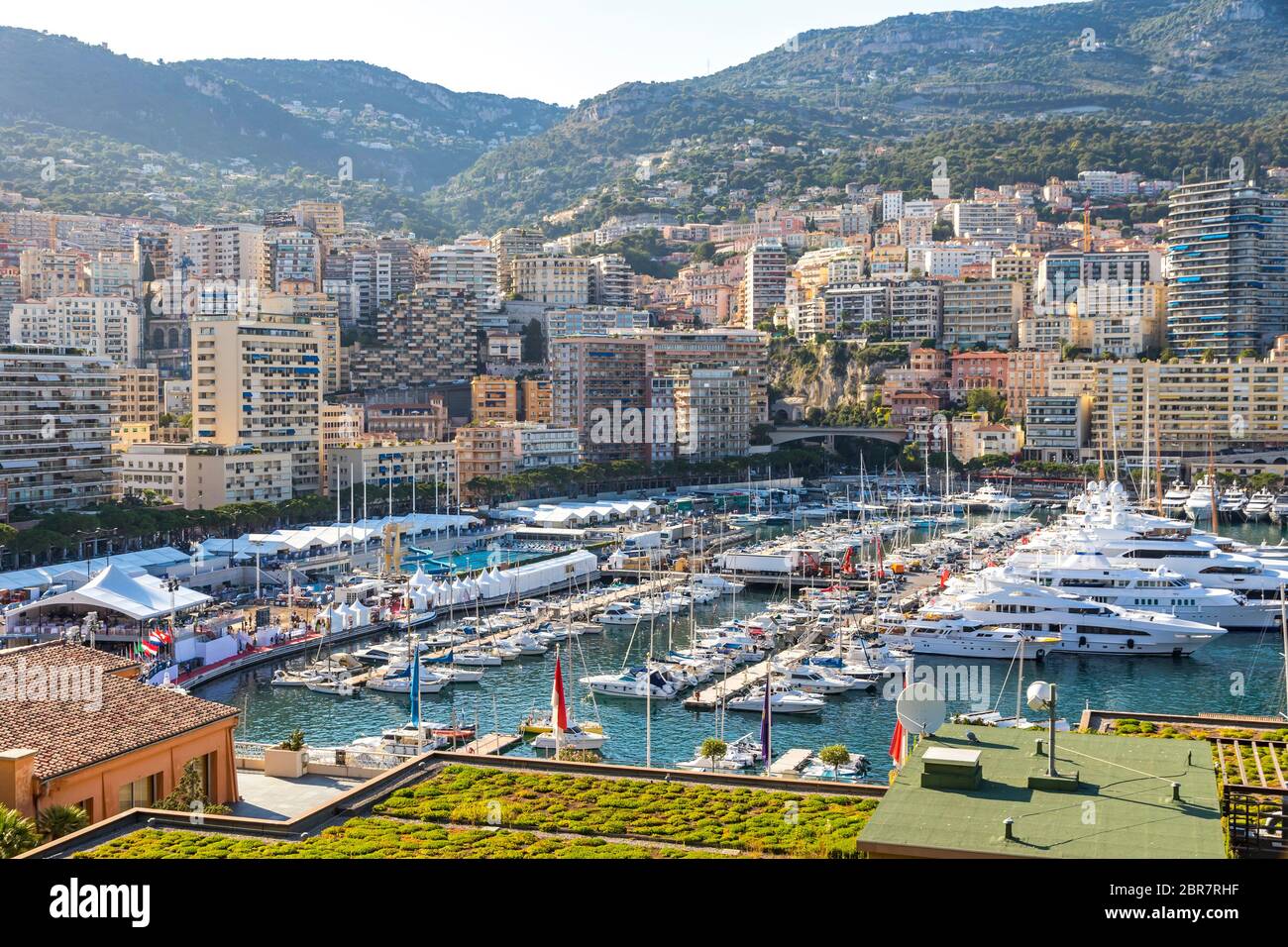 Picturesque view of luxury yachts and apartments in harbor of Monte ...