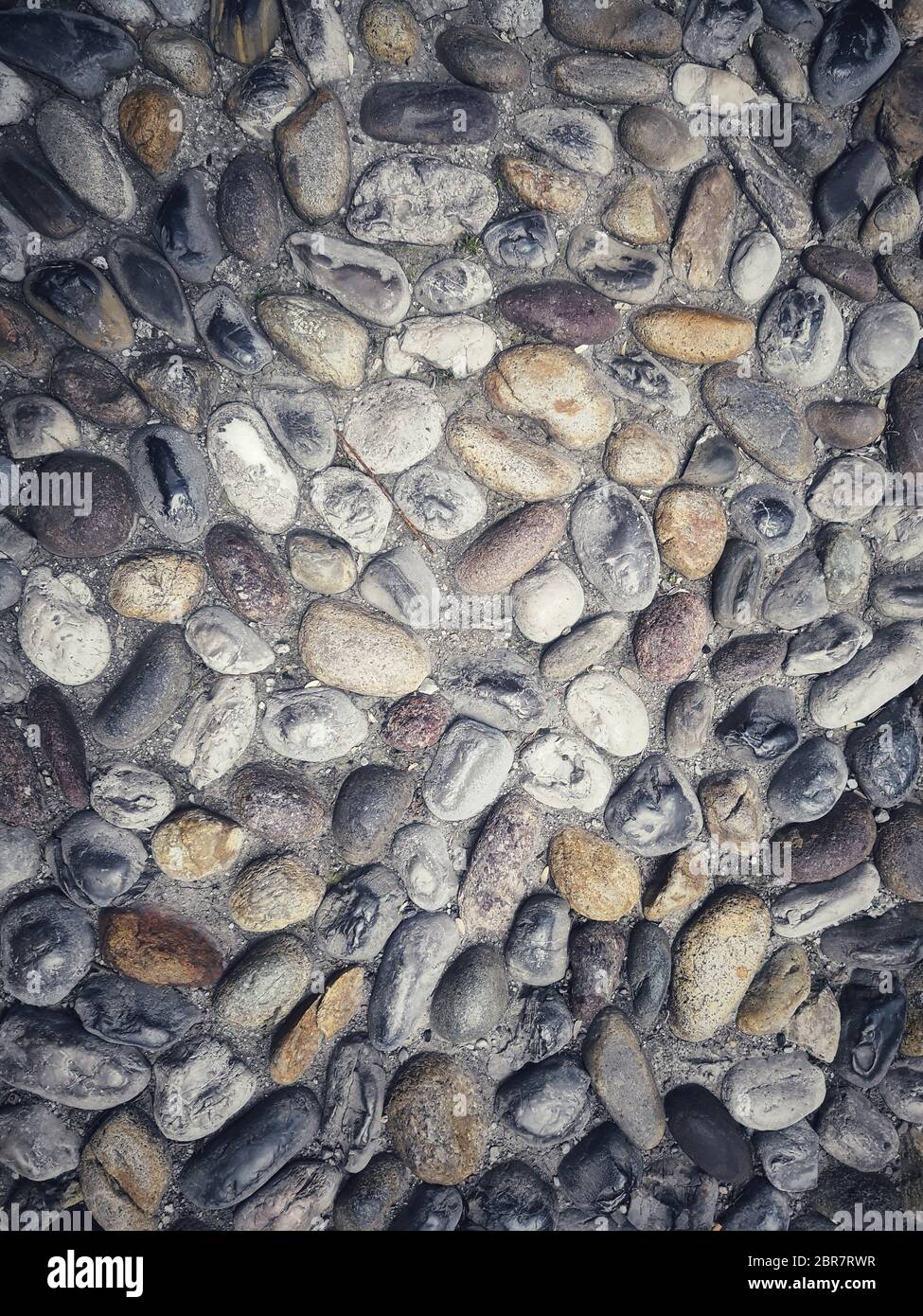 Color image of a pavement made of round stones Stock Photo - Alamy