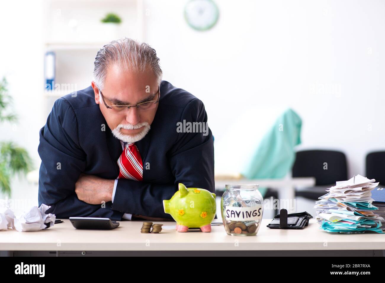 Old accountant in budget planning concept Stock Photo - Alamy