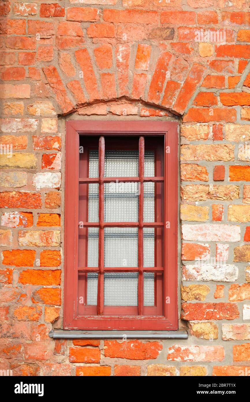 Old window with brick house wall and window bars Stock Photo - Alamy