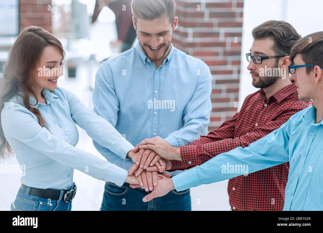 Group of people hands together partnership teamwork Stock Photo - Alamy
