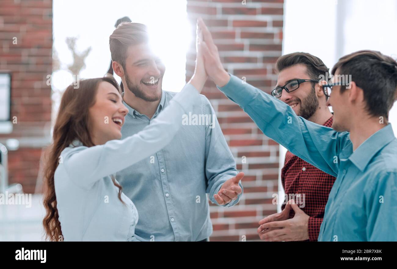 happy creative business people giving high-five in meeting room Stock ...