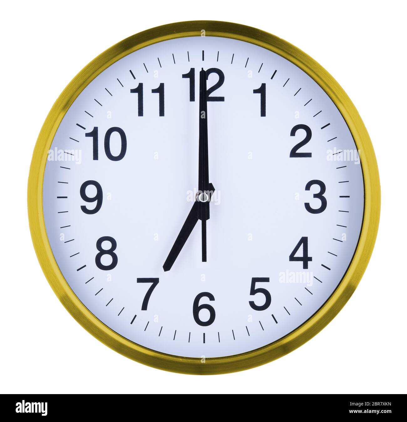 Wall clock isolated on white background. Seven oclock Stock Photo - Alamy