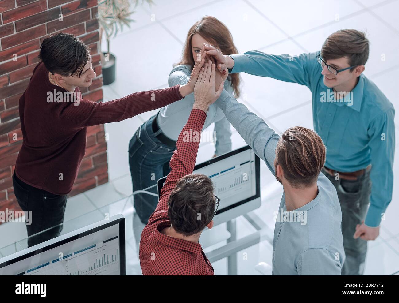Business people happy showing team work and giving five in offic Stock ...