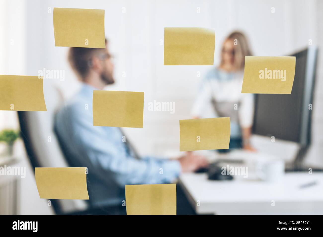 Boss sitting behind desk employees hi-res stock photography and images ...