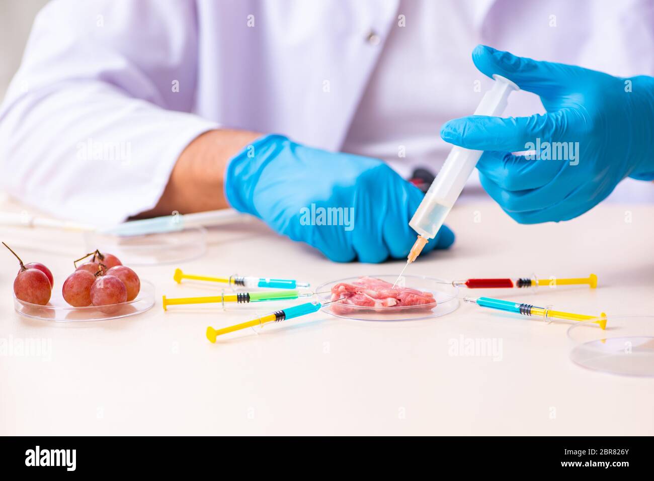 Young nutrition expert testing food products in lab Stock Photo - Alamy