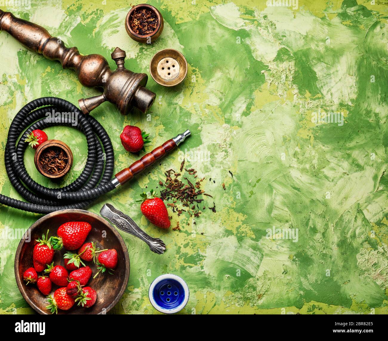 Oriental hookah with strawberry flavor.Turkish shisha with berry ...