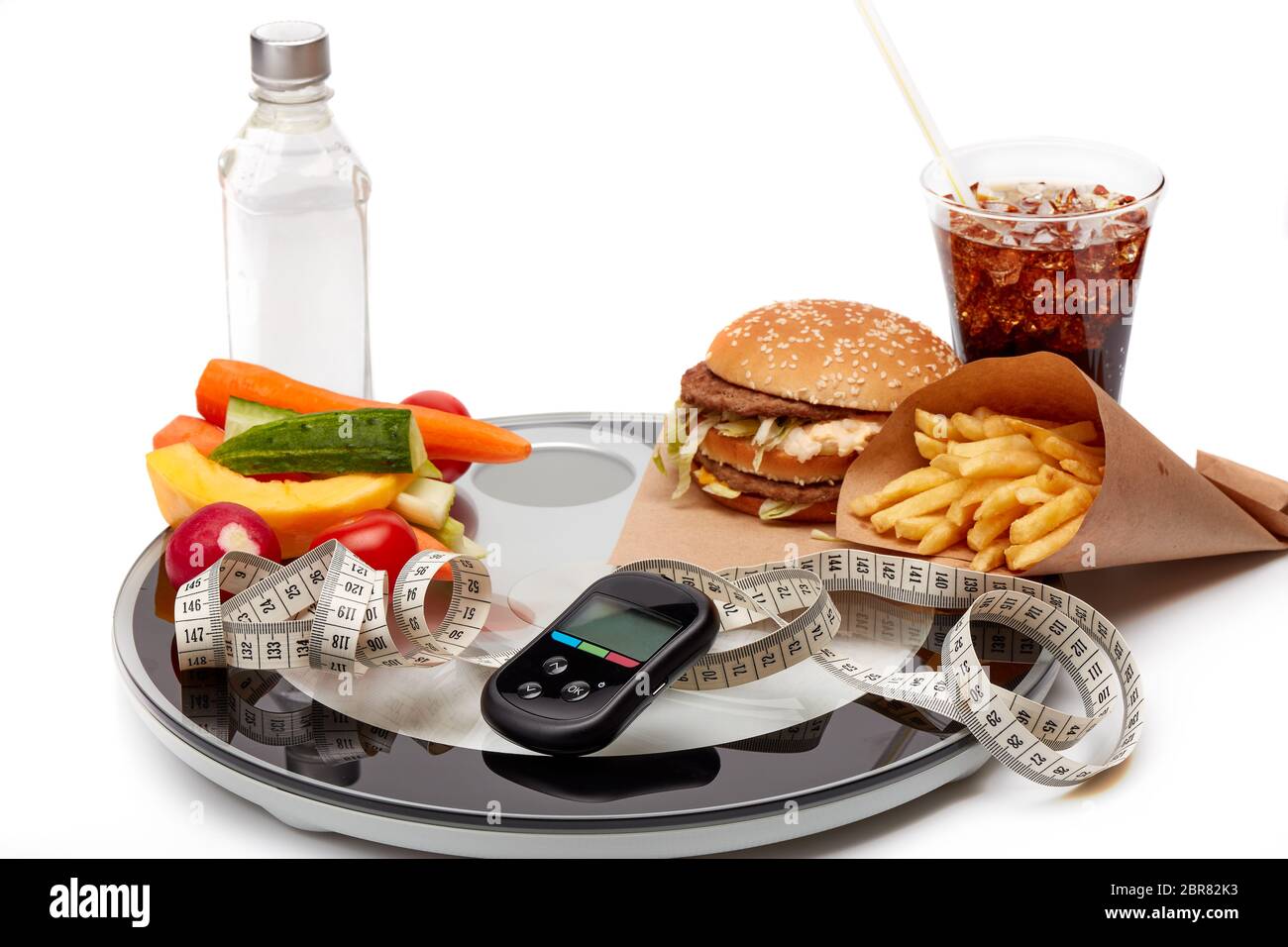 Still life with good and bad food, scales, measuring tape and blood ...