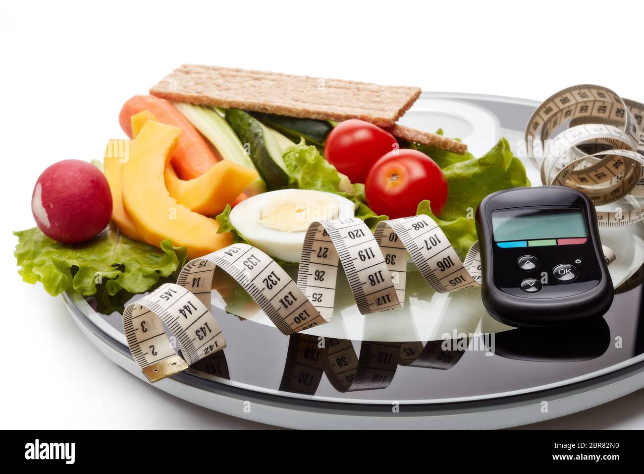 Still life with healthy food, scales, measuring tape and blood glucose ...