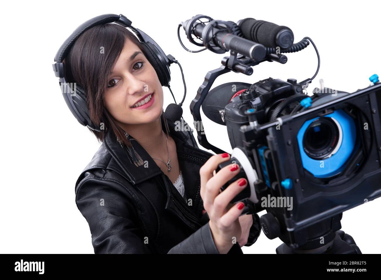 young woman with professional video camera, DSLR, isolated on white ...