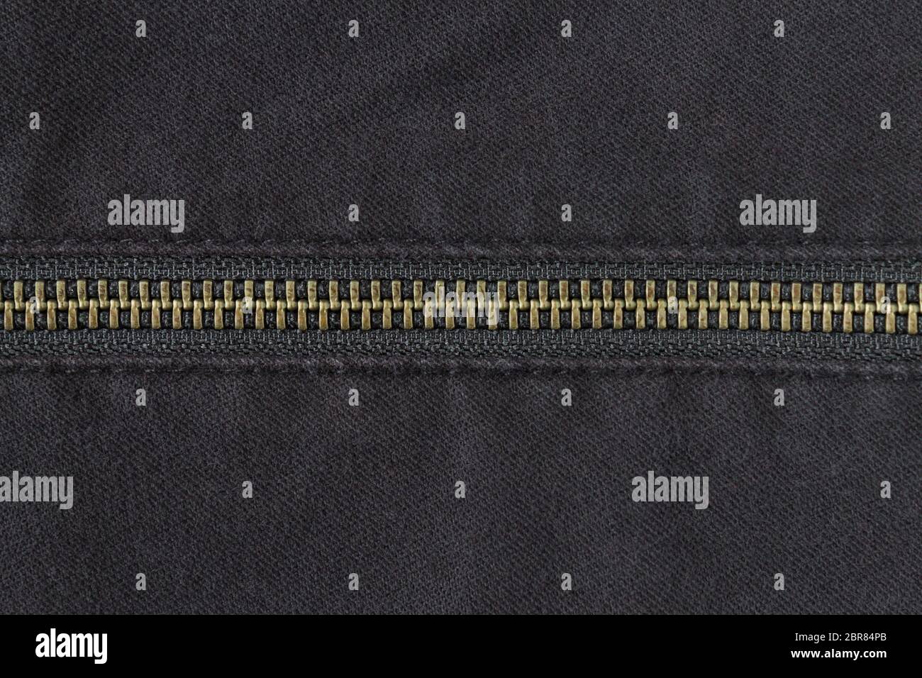 Brass Zip on Black Jeans Texture Background. Closed Brass Zip on Black ...