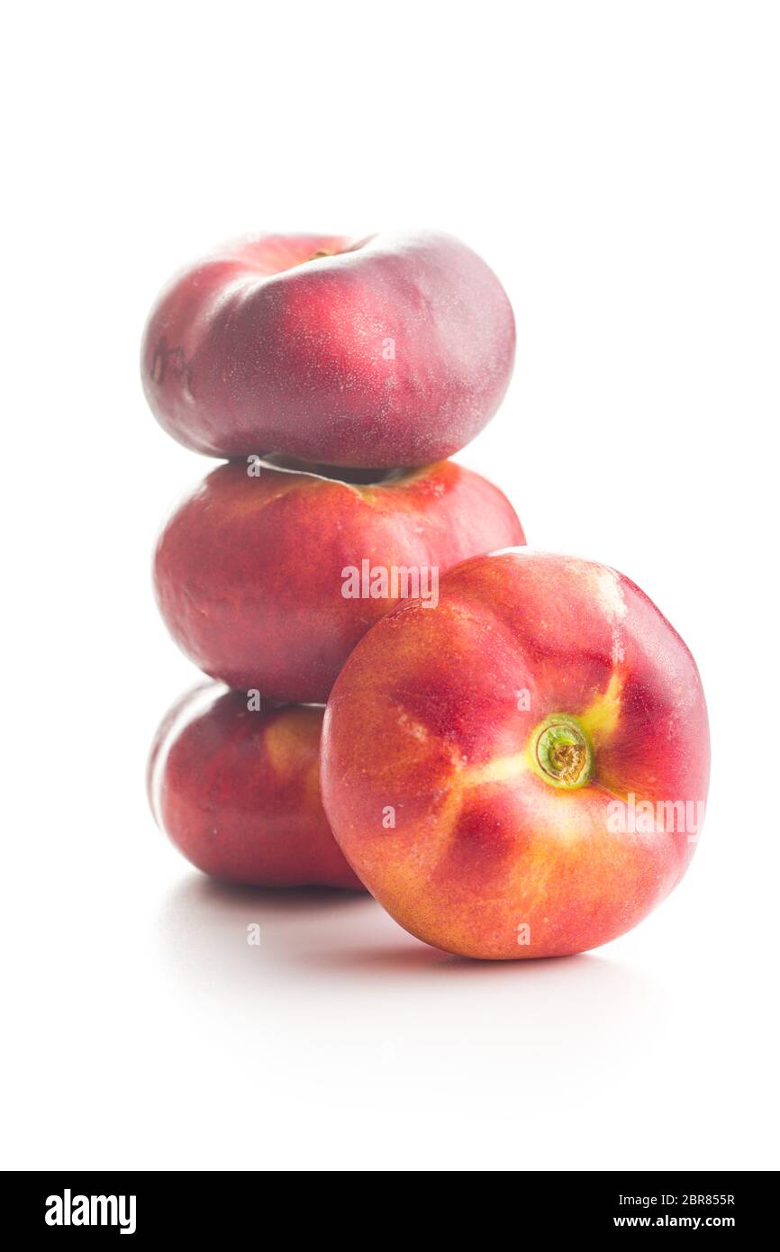 Ripe flat nectarines isolated on white background Stock Photo - Alamy