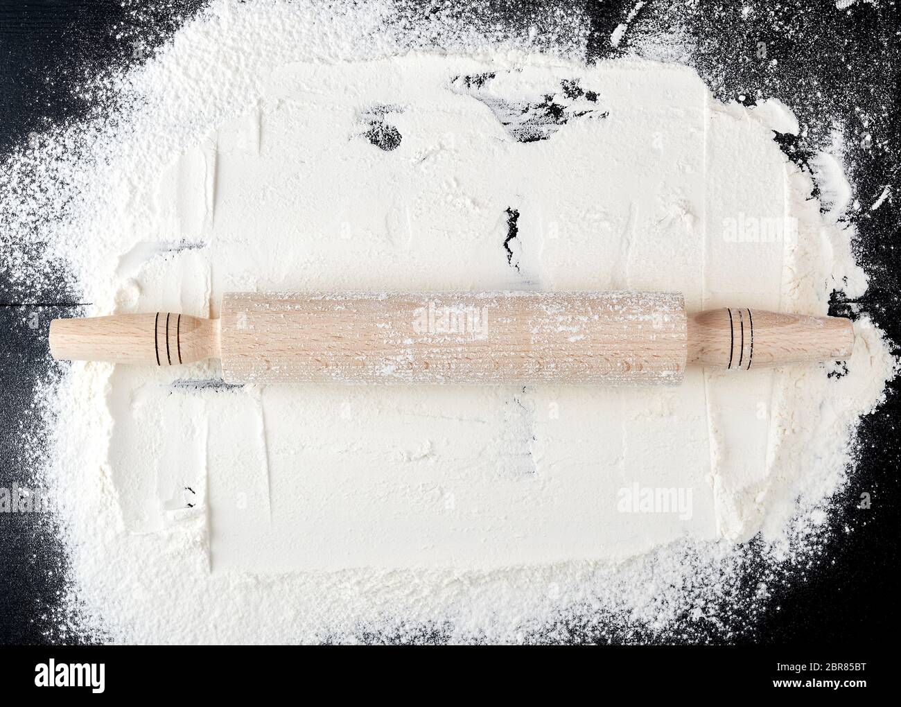 wooden rolling pin, top view, scattered white wheat flour Stock Photo ...
