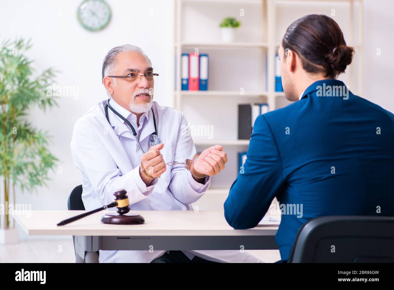 Doctor in courthouse meeting with lawyer Stock Photo - Alamy