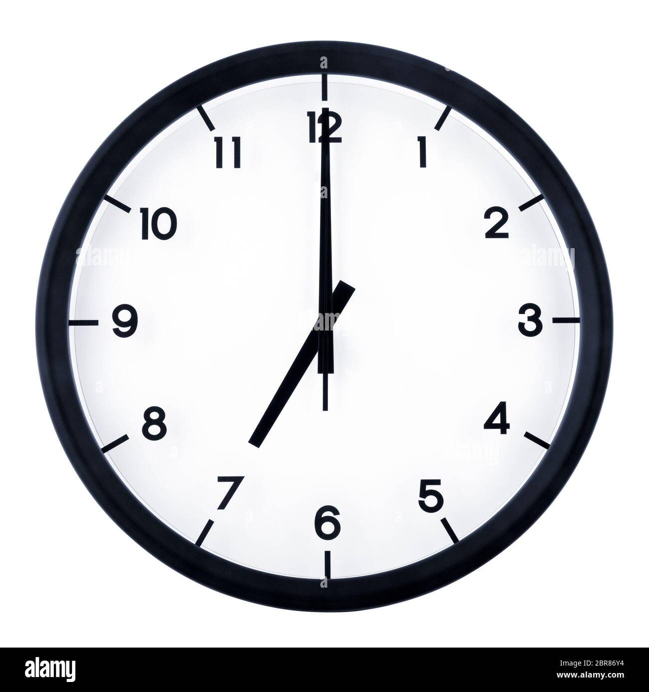 Classic analog clock pointing at 7 o'clock, isolated on white ...