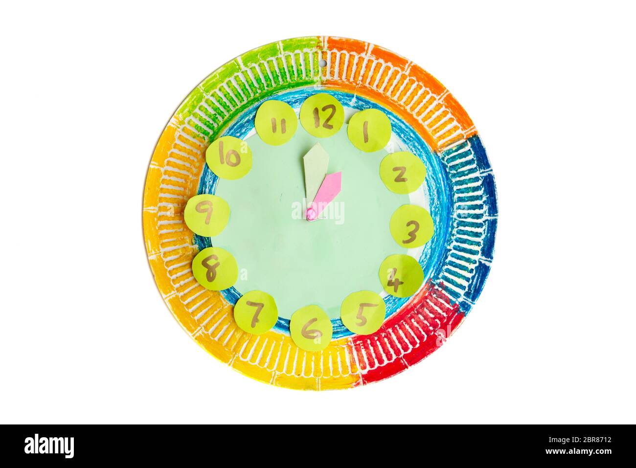 Colorful child handwork clock pointing at 1 o'clock, isolated on white ...