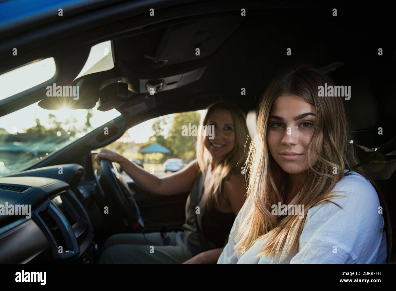 Mother and daughter inside care going for a drive Stock Photo - Alamy