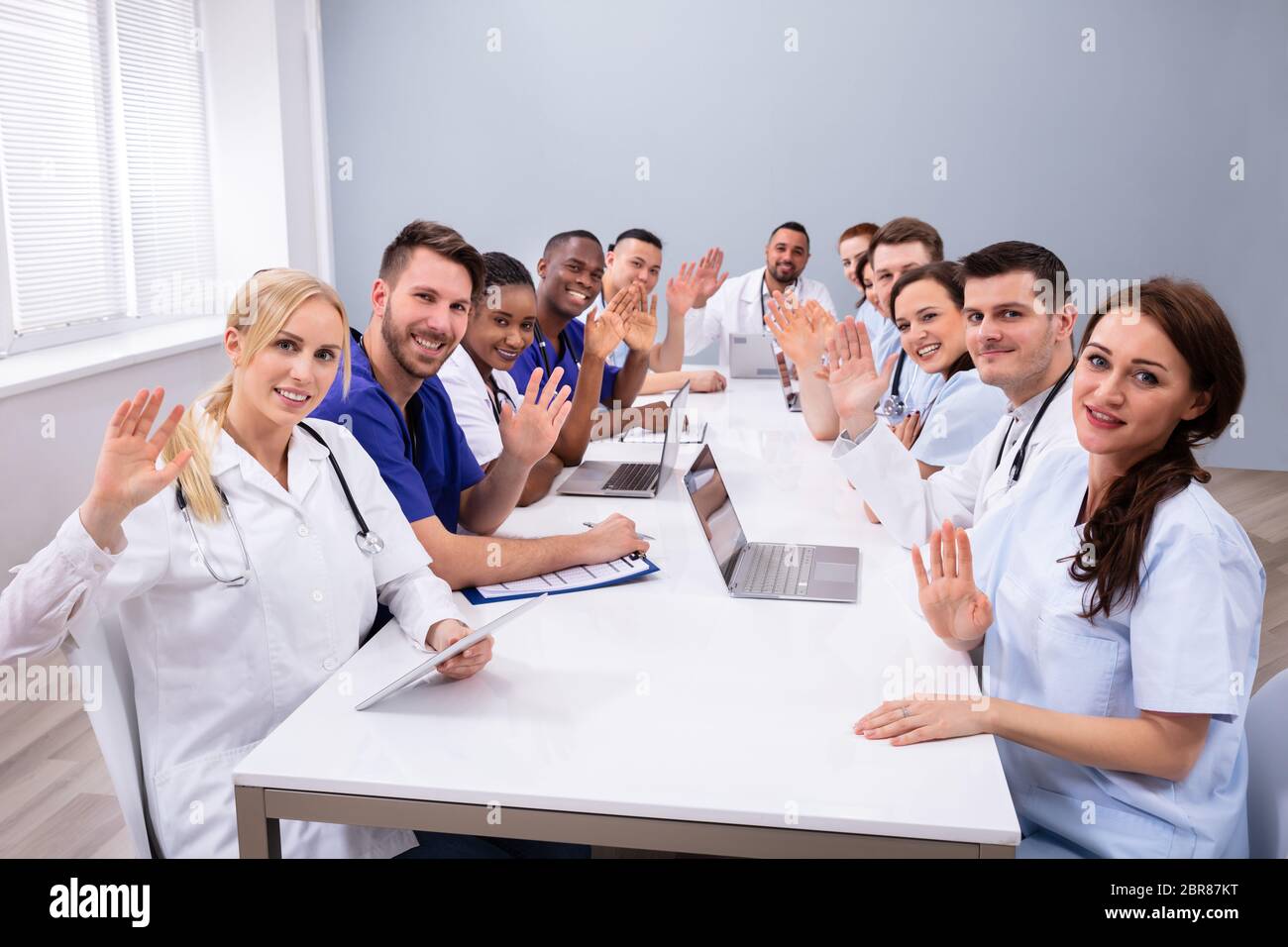 Team happy doctors sitting hi-res stock photography and images - Alamy