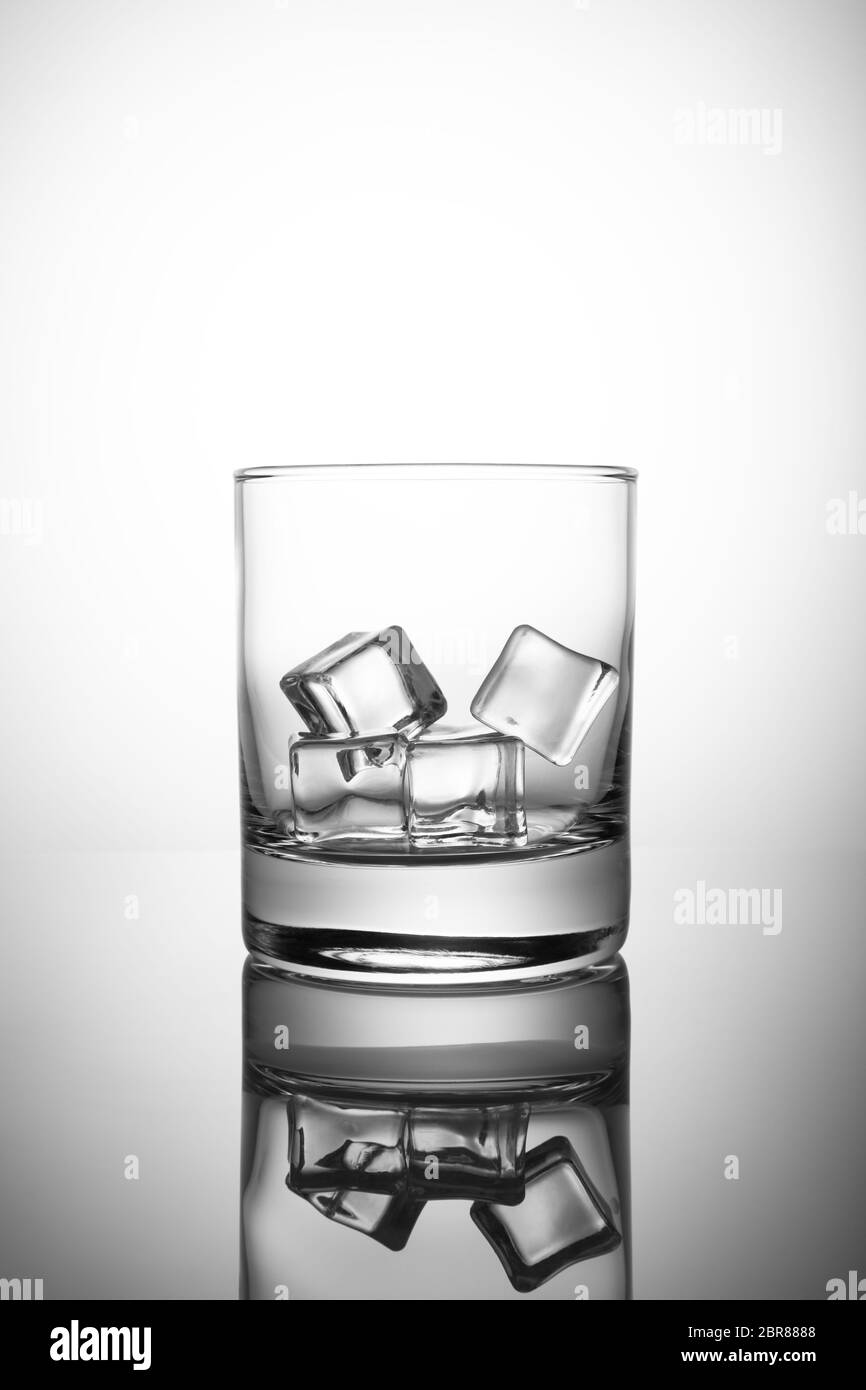 Empty rocks glass with ice-cubes, isolated on white background Stock ...