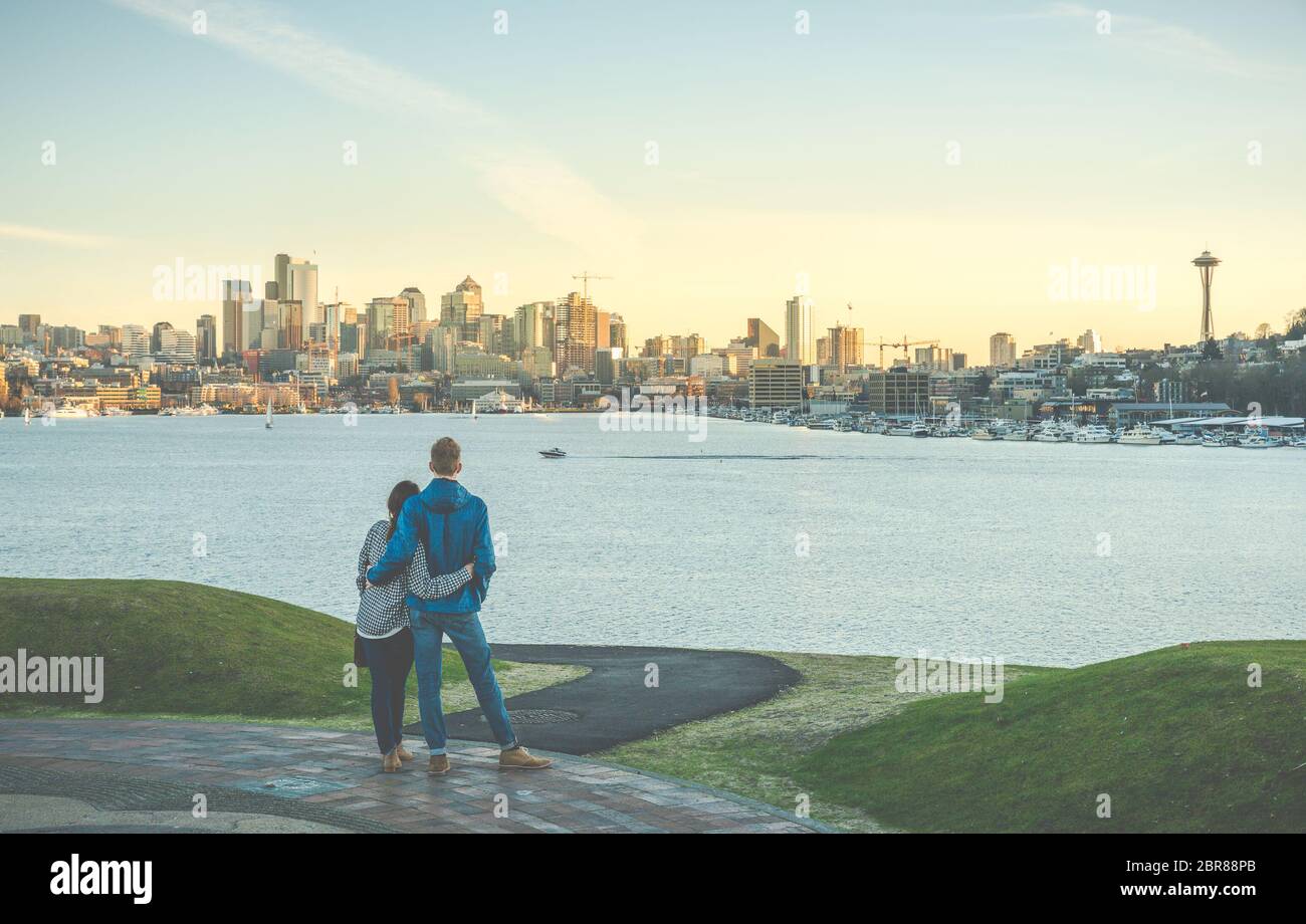 a couple hug and looking Seattle city landscape with sunset ,Seattle ...