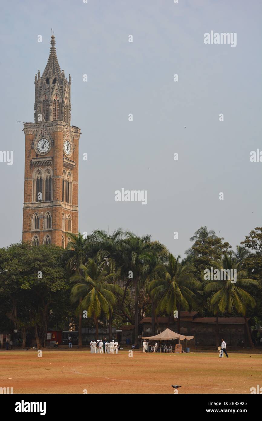 A very English game of cricket takes place on the Oval Maidan, towered ...