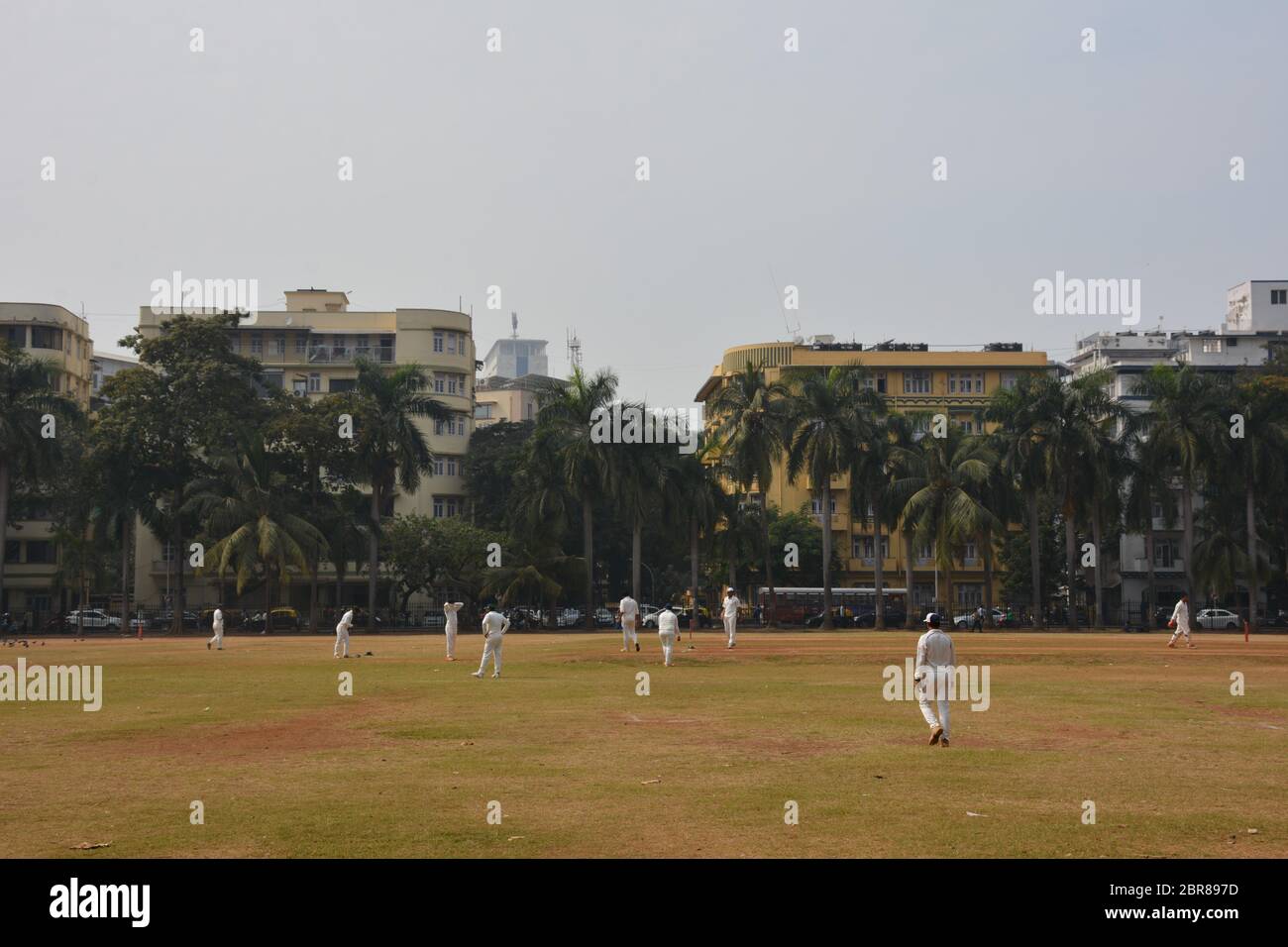 A game of cricket at the Oval Maidan in Mumbai, with Art Deco ...